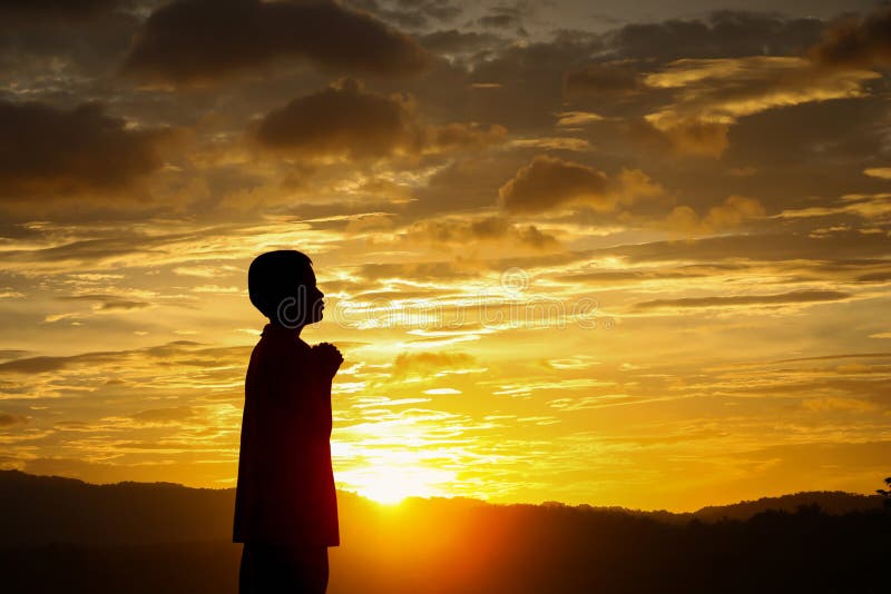 Silhouette boy praying stock photo. Image of cultural - 121624772