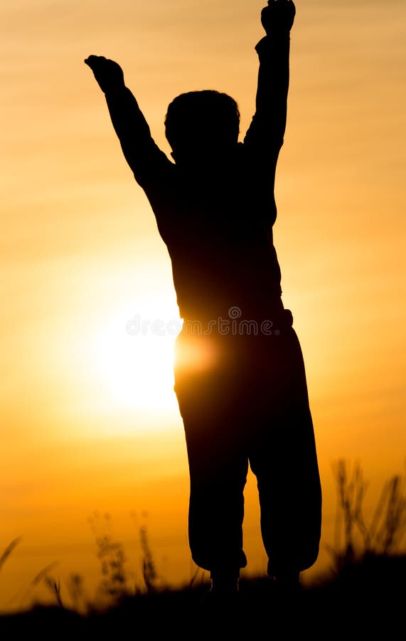 Silhouette of a Boy in the Sunset Stock Photo - Image of young, jump ...
