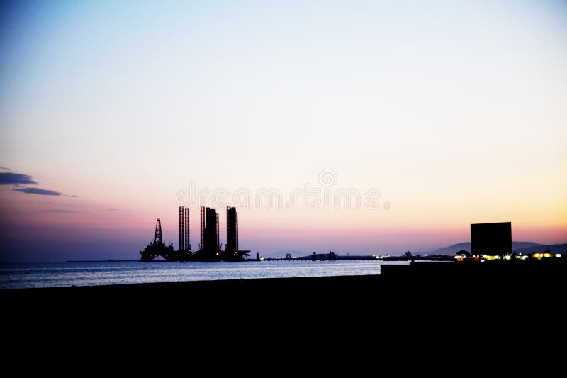 Silhouette of Bridge Connected Offshore Oil Production Platforms at Oil ...