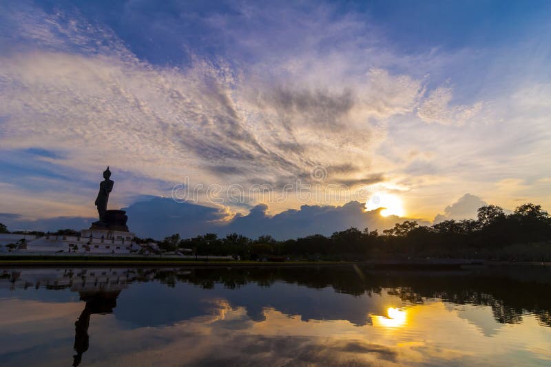 Silhouette of Buddha Statue in Water Reflection, Sunset Backgrou Stock ...