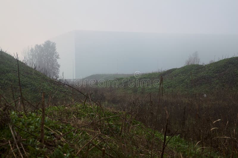 Silhouette of a Building in the Fog Framed by Embankments Stock Image ...