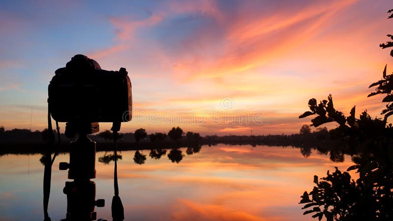 Silhouette of a Camera at Sunset.Dslr Camera Shooting on a Cityscape ...