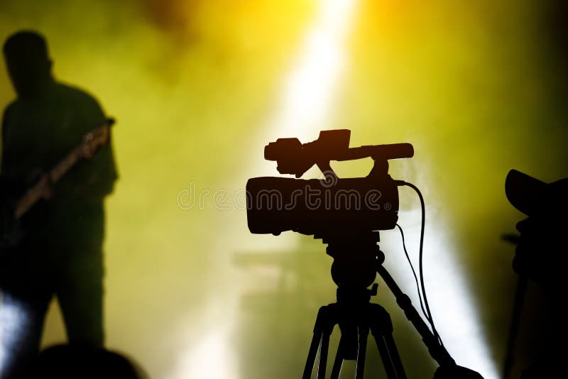 Silhouette of Cameraman and Camera on a Concert. Stock Photo - Image of ...