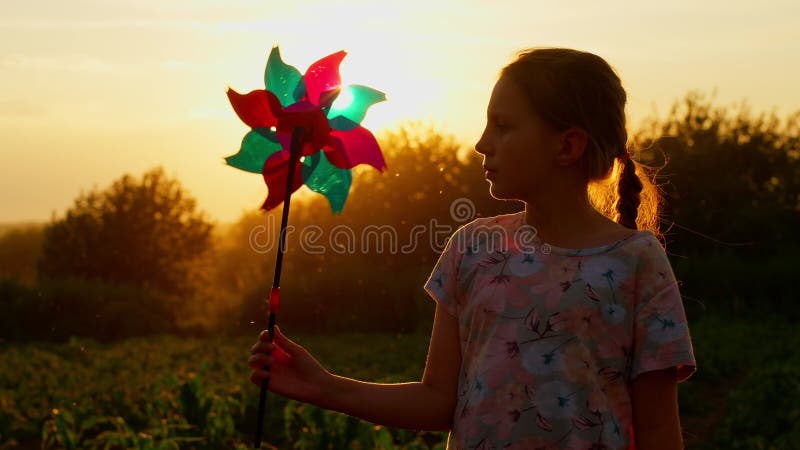 Silhouette of Child Girl Holding Wind Toy Stock Video - Video of play ...