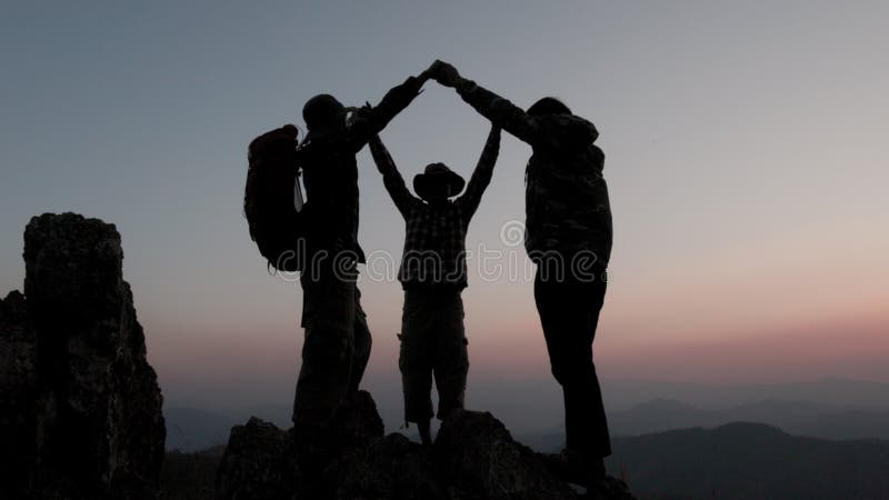 Silhouette of Climbing Team Success on the Mountain. Leadership Concept ...