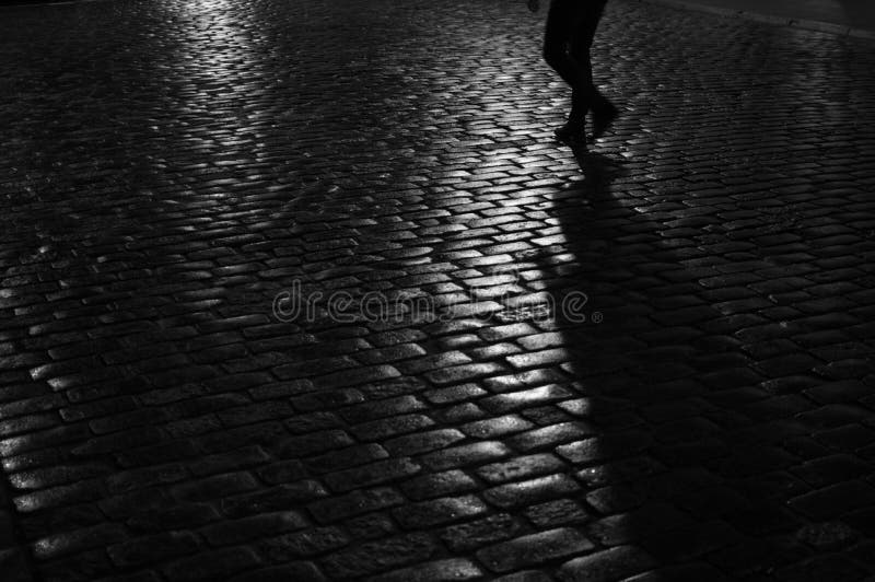 Silhouette on Cobblestone Path in Warsaw, Poland at Night Stock Image ...