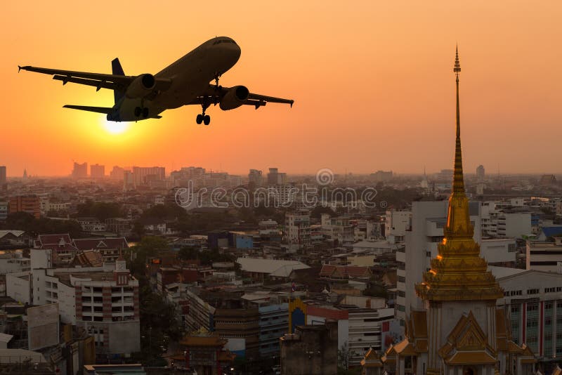 Silhouette Commercial Plane Flying Over City during Sunset Stock Image ...