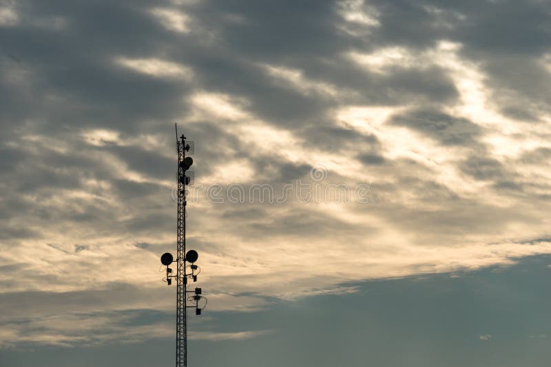 The Silhouette of the Communication Tower with Beautiful Orange Light ...