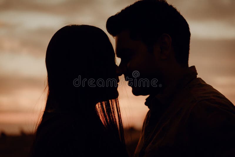 Silhouette of a Couple Romantically during the Sunset Stock Image ...