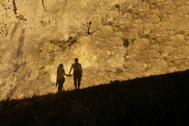Silhouette of a Couple in Love on a Rock, Shadow from the Echo at Night ...