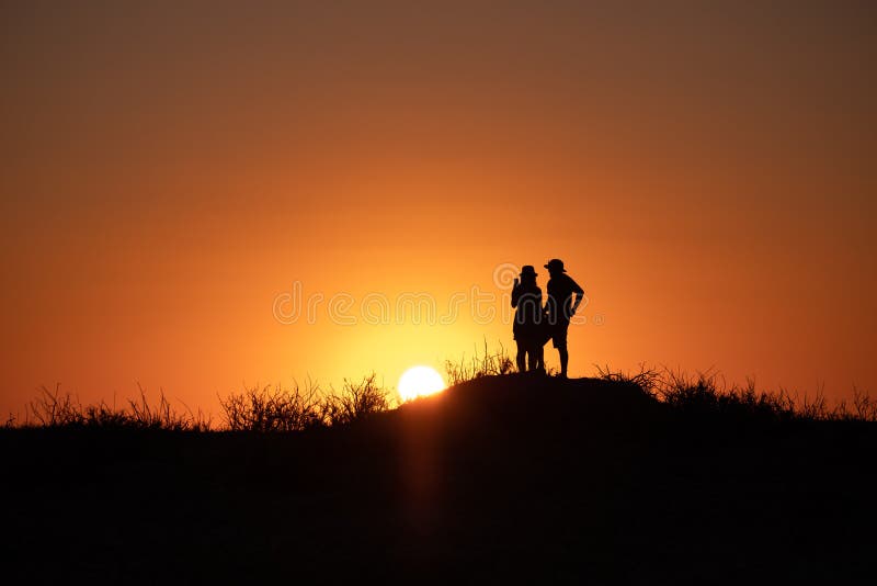 Silhouette of a Couple with Sunset Background in Australia Outback ...