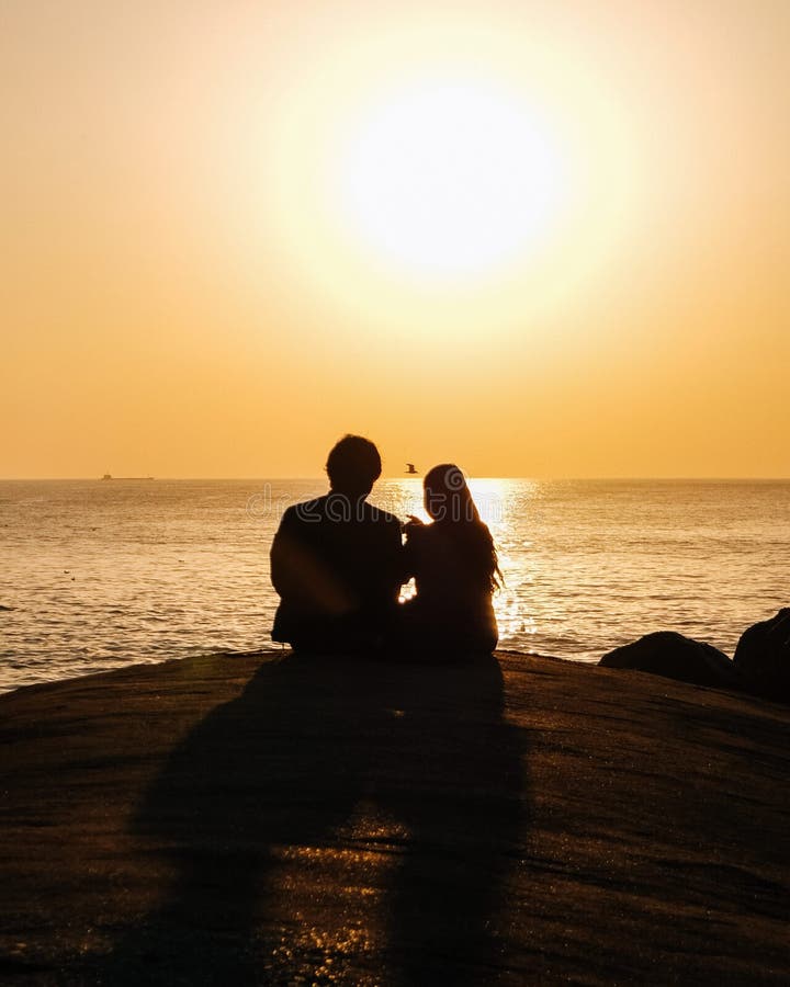 Couple Watching The Sunset In Beach Stock Image - Image of fervour ...