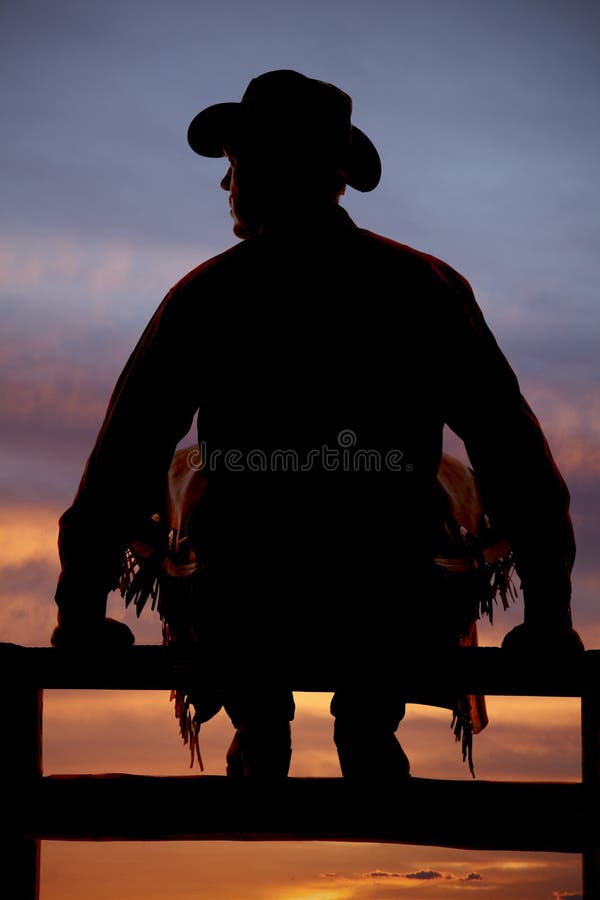 Silhouette of Cowboy Sitting on Fence Stock Image - Image of rough ...