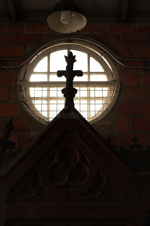 Silhouette Cross Against Round Window Stock Photo - Image of brick ...