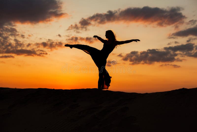 Silhouette of a Dancer at Sunset. Stock Photo - Image of jump, ether ...