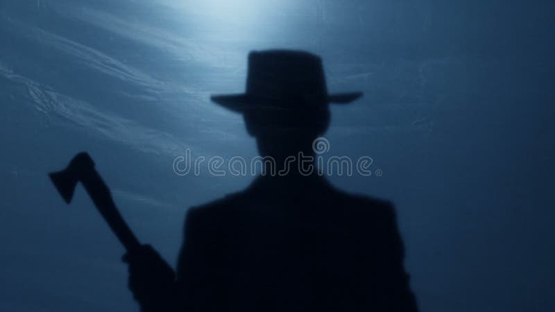 Silhouette of Dangerous Killer Approaching Victim with Axe in Hand ...
