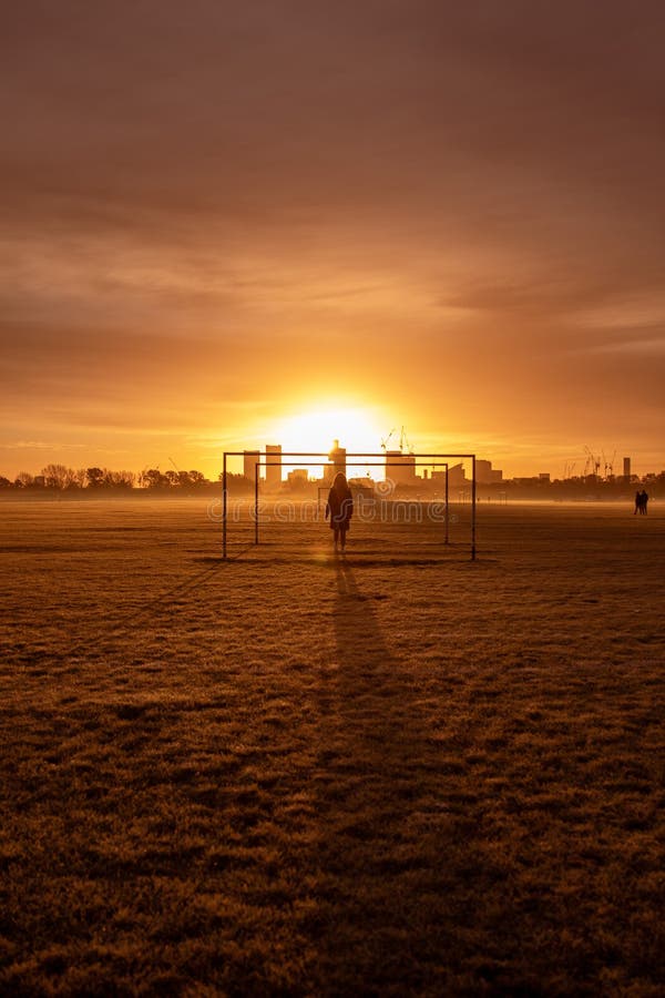 Silhouette of a Determined Woman Walking Towards the Camera during ...