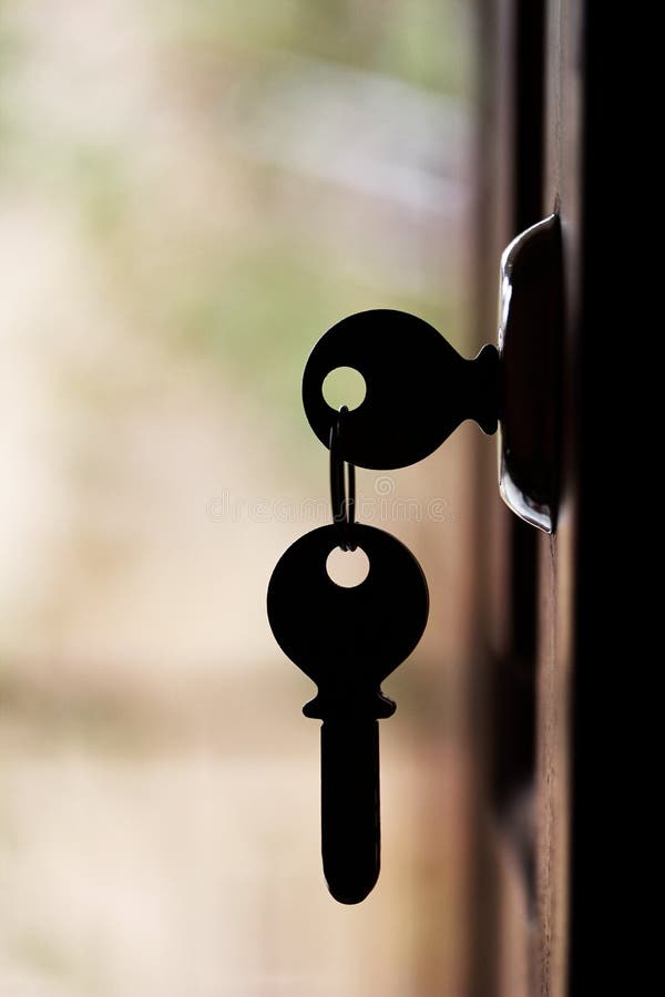 Silhouette of Door Keys Hanging on the Open Door Stock Photo - Image of ...