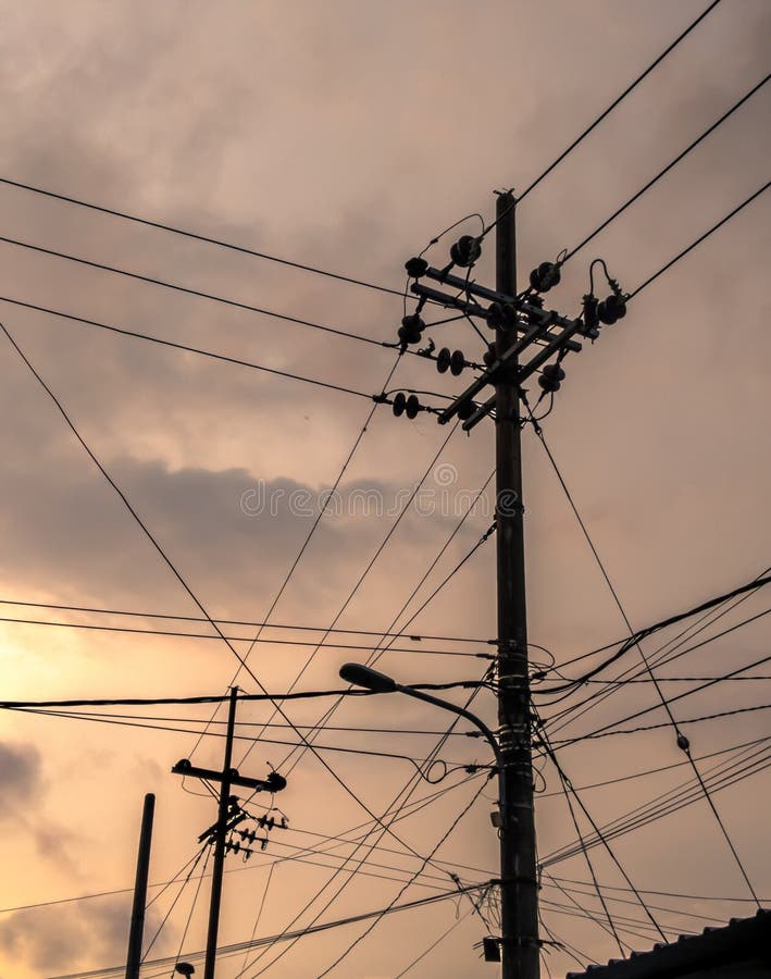 SILHOUETTE of ELECTRIC POLE of CABLE NETWORK with DUSK BACKGROUND Stock ...