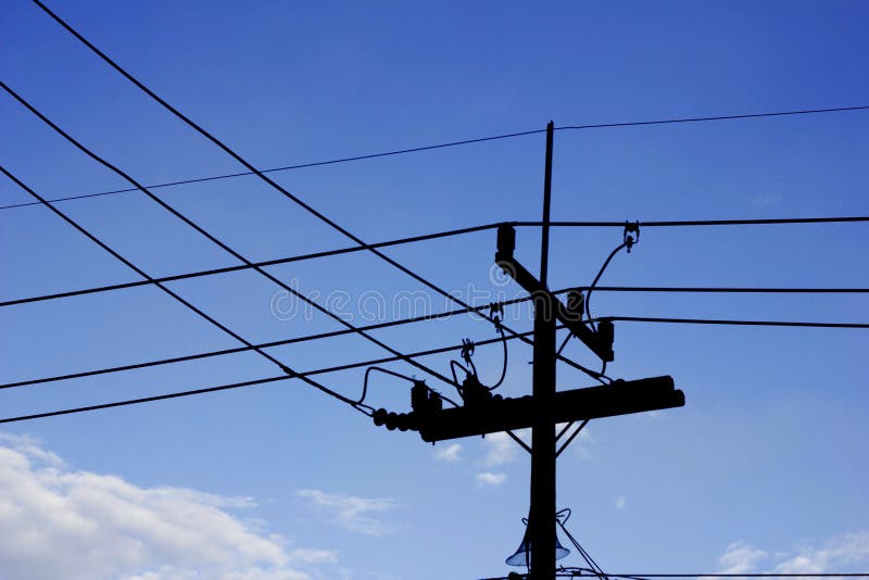 Silhouette Electricity Post with Wired and Blue Sky Background Stock ...