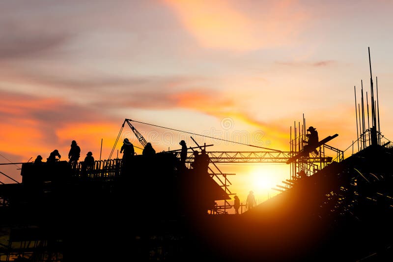 Silhouette of Engineer and Worker Checking Project at Building Site ...