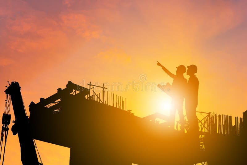 Silhouette of Engineer and Worker Checking Project at Building Site ...