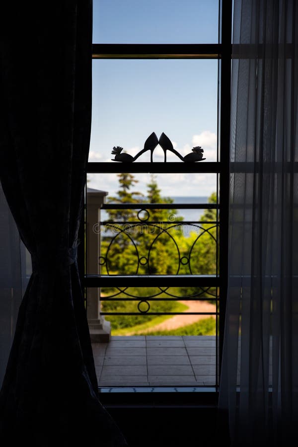 Silhouette of Female Shoes on the Window Background Stock Photo - Image ...