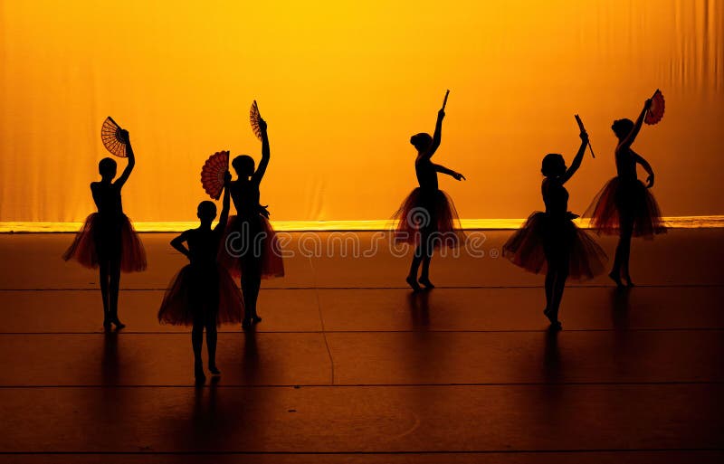 Silhouette of the Females Dancing with Fans Stock Image - Image of ...