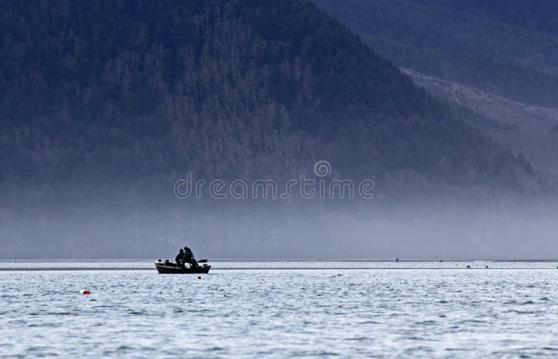 Silhouette of Fishermen in Boat on Bay in Mist Stock Image - Image of ...