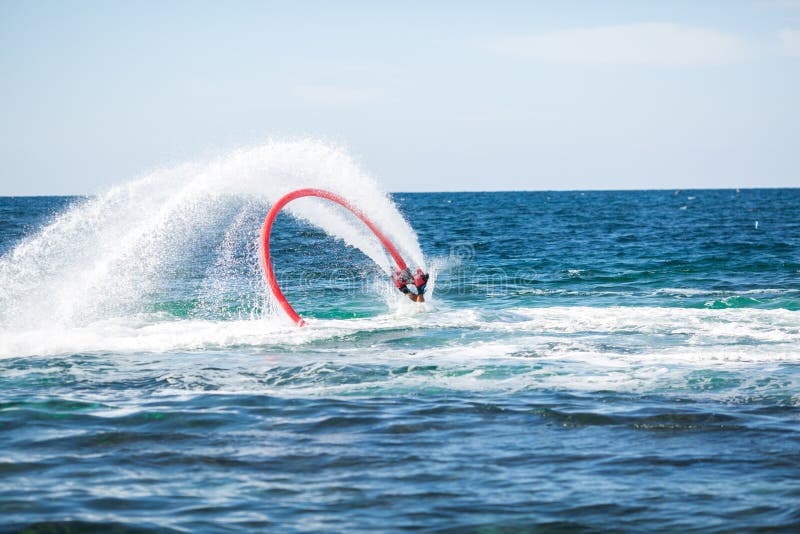 Silhouette of a Fly Board Rider at Sea. Stock Image - Image of boat ...