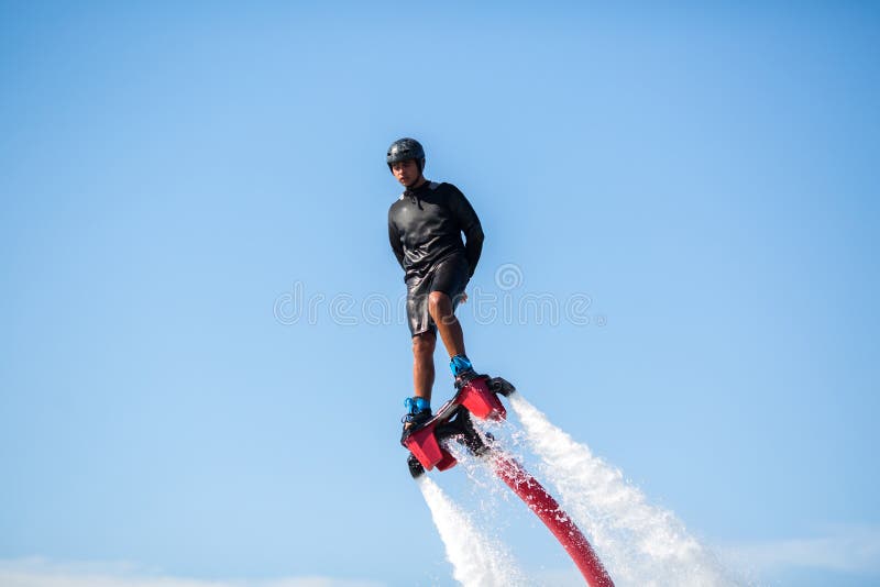 Silhouette of a Fly Board Rider at Sea. Stock Photo - Image of rider ...