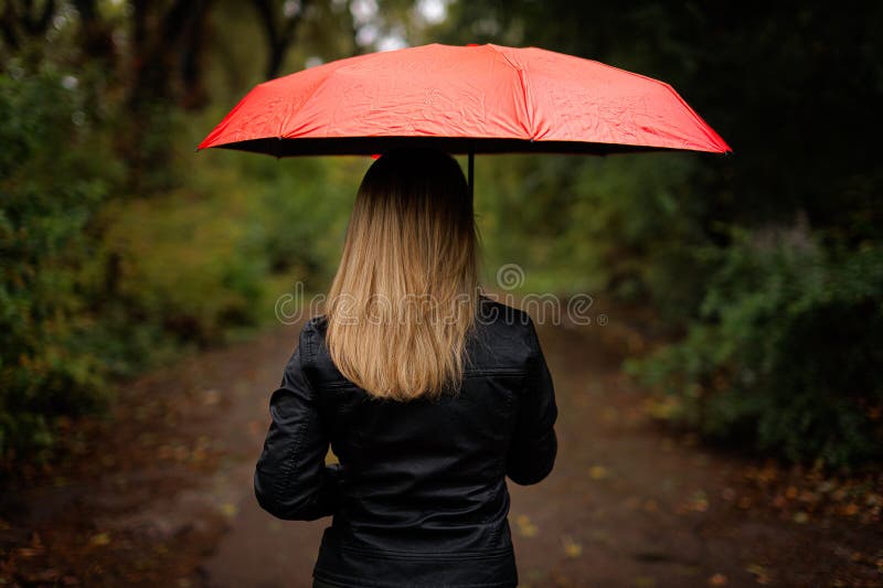 Silhouette of a Girl from the Back Under an Umbrella. a Red Umbrella in ...