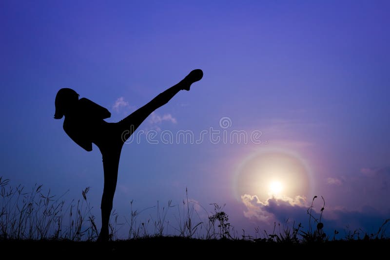 Silhouette of Girl Exercising Side Kick in the Nature Stock Photo ...