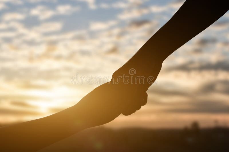 Silhouette of Giving a Help Hand, Hope and Support Each Other Over ...