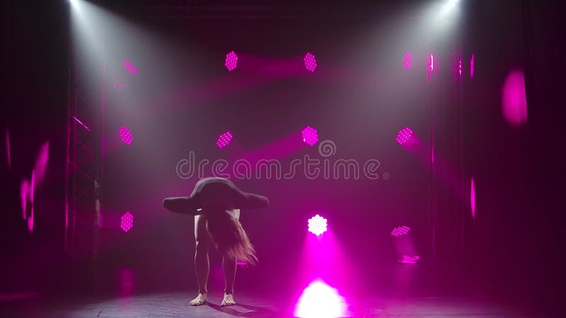 Silhouette of a Graceful Girl Practicing Contempt in the Dark of the ...