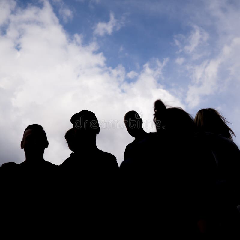 A Silhouette of a Group of People with in the Background Stock Image ...