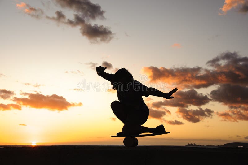 Silhouette of a Guy Balancing on a Balance Board Stock Image - Image of ...