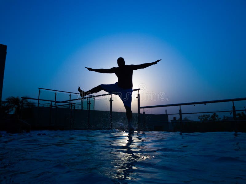 Guys Jumping into Water with the Sunset Stock Image - Image of jumping ...