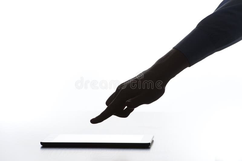 Silhouette of Hand Over Modern Tablet with Blank Screen. Stock Image ...