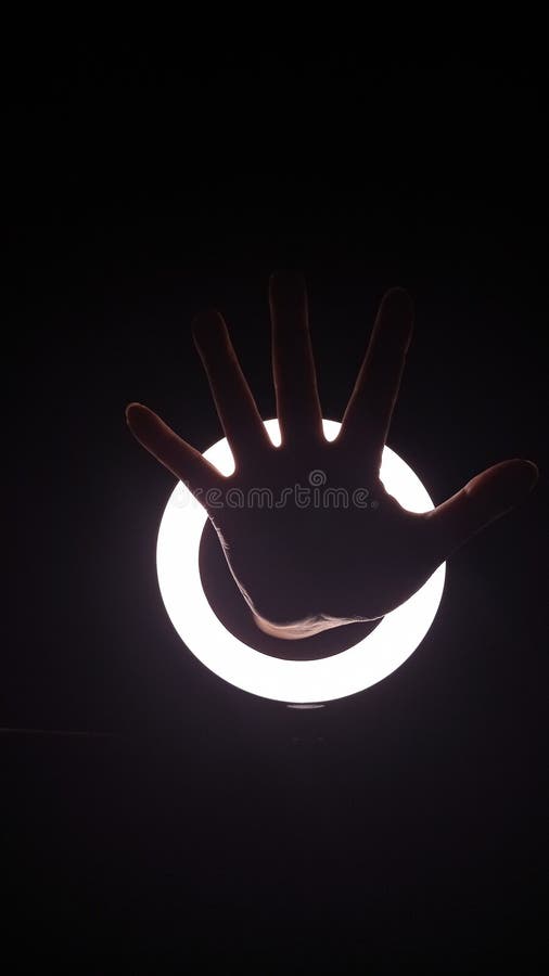 Silhouette of a Hand Passing the Light Stock Image - Image of ...