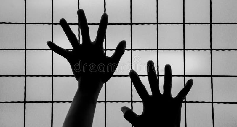 Silhouette of Hands Behind Bars in Prison, Black and White Stock Photo ...