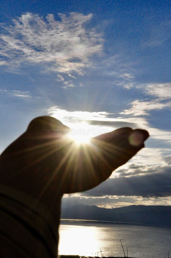 Silhouette Hands Catching the Falling Sun during Sunset. Stock Image ...