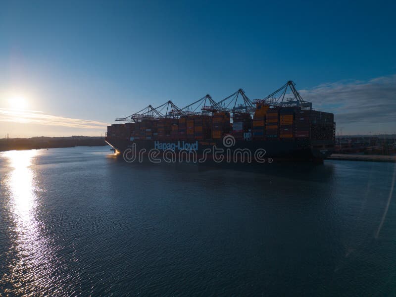 Silhouette of Hapag-Lloyd Container Ship at Sunset with Sun Reflection ...