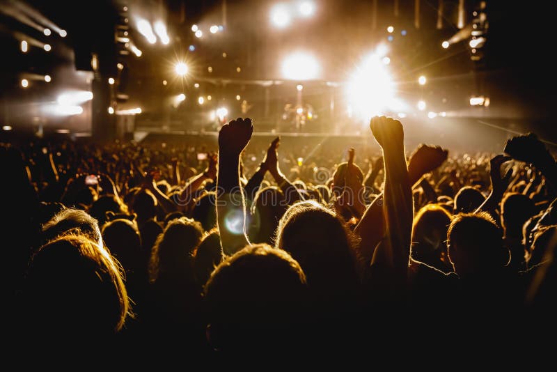 Silhouette of a Happy Crowd with Hands Up during a Big Rock Concert ...