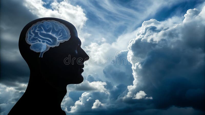 Silhouette of a Head with a Visible Brain Against a Dramatic Cloudy Sky ...