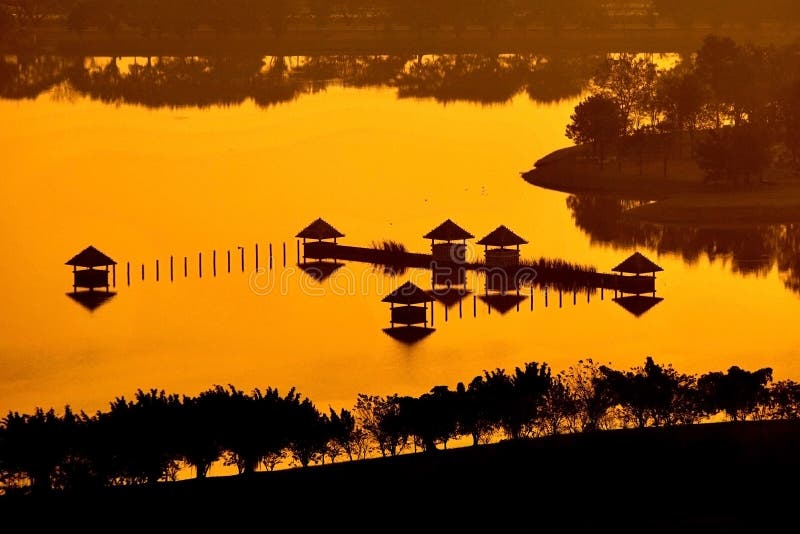 Silhouette of a House and a Tree in the Water. Stock Image - Image of ...