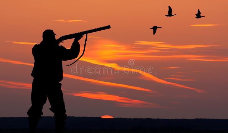 The Silhouette Of A Hunter On Sunset Background Stock Image - Image of ...