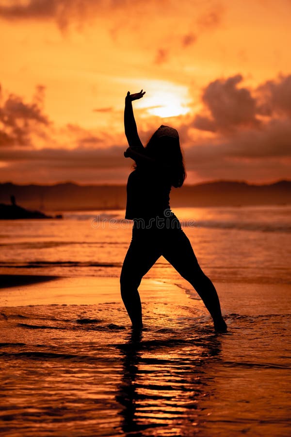 Silhouette Image of an Asian Woman Doing Ballet Movements Very Flexibly ...