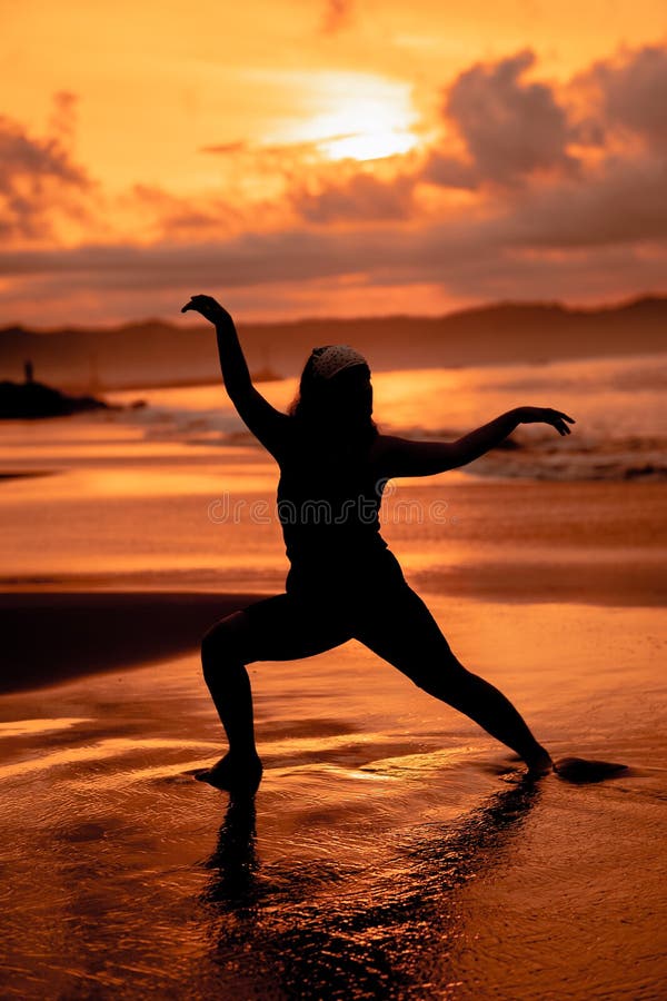 Silhouette Image of an Asian Woman Doing Ballet Movements Very Flexibly ...
