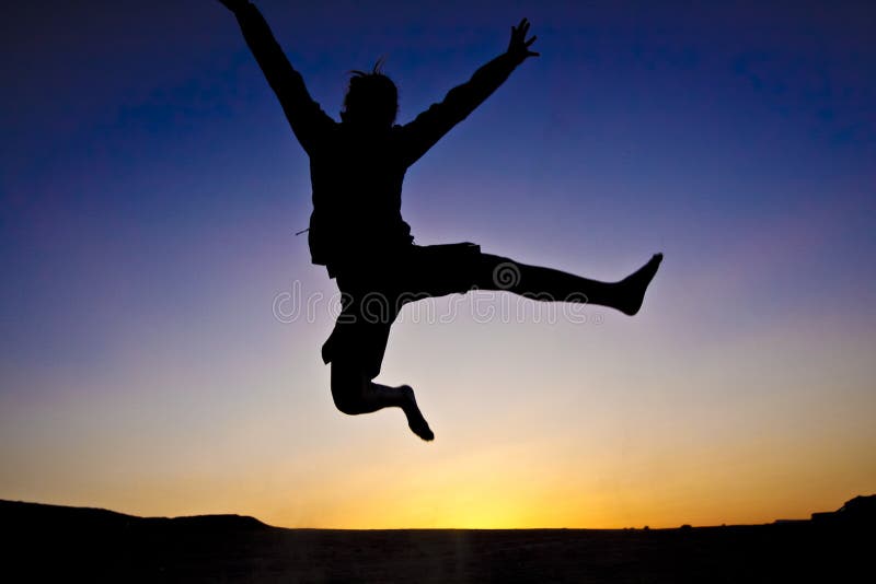 Silhouette Jumping for Joy at Sunset Stock Photo - Image of page ...